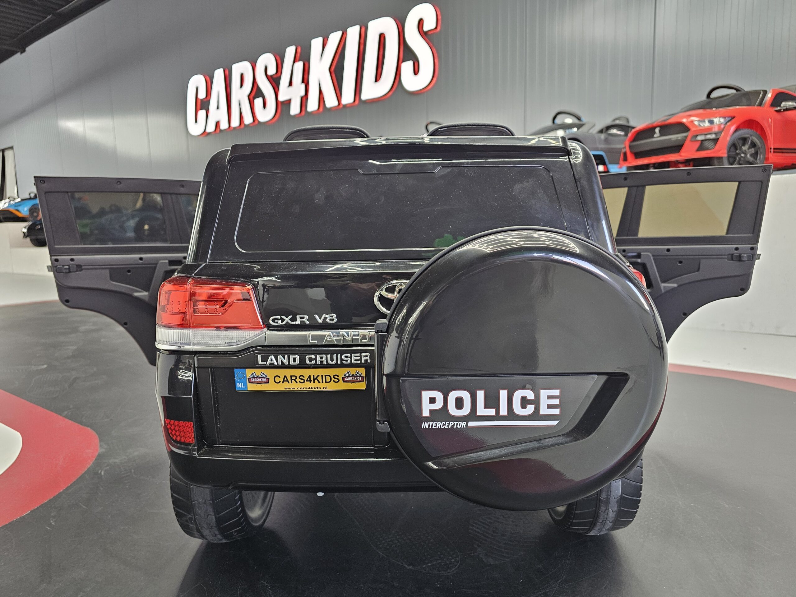 Kinderauto Toyota Land Cruiser politie 24 volt - Cars4Kids
