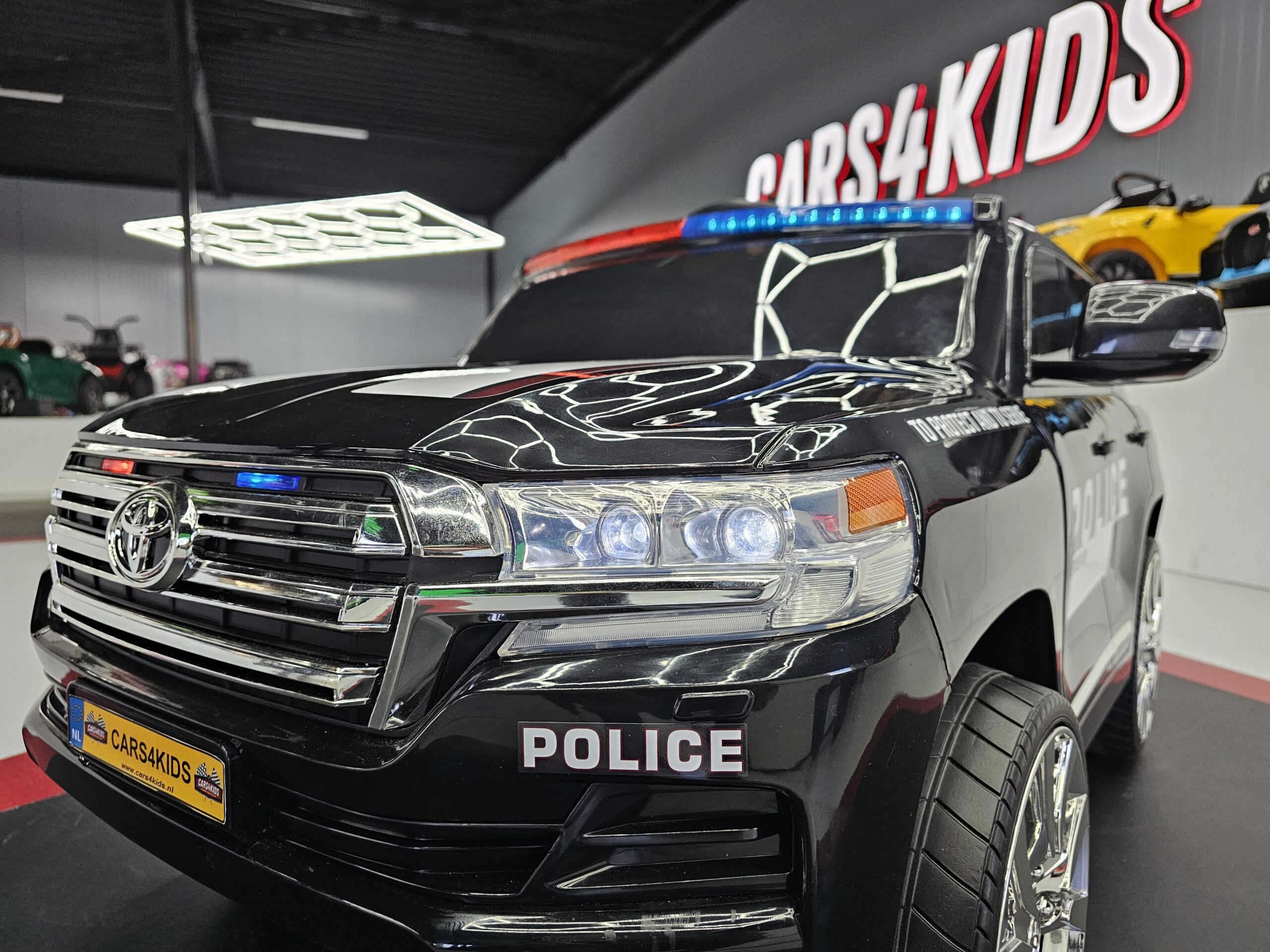 Kinderauto Toyota Land Cruiser politie 24 volt - Cars4Kids