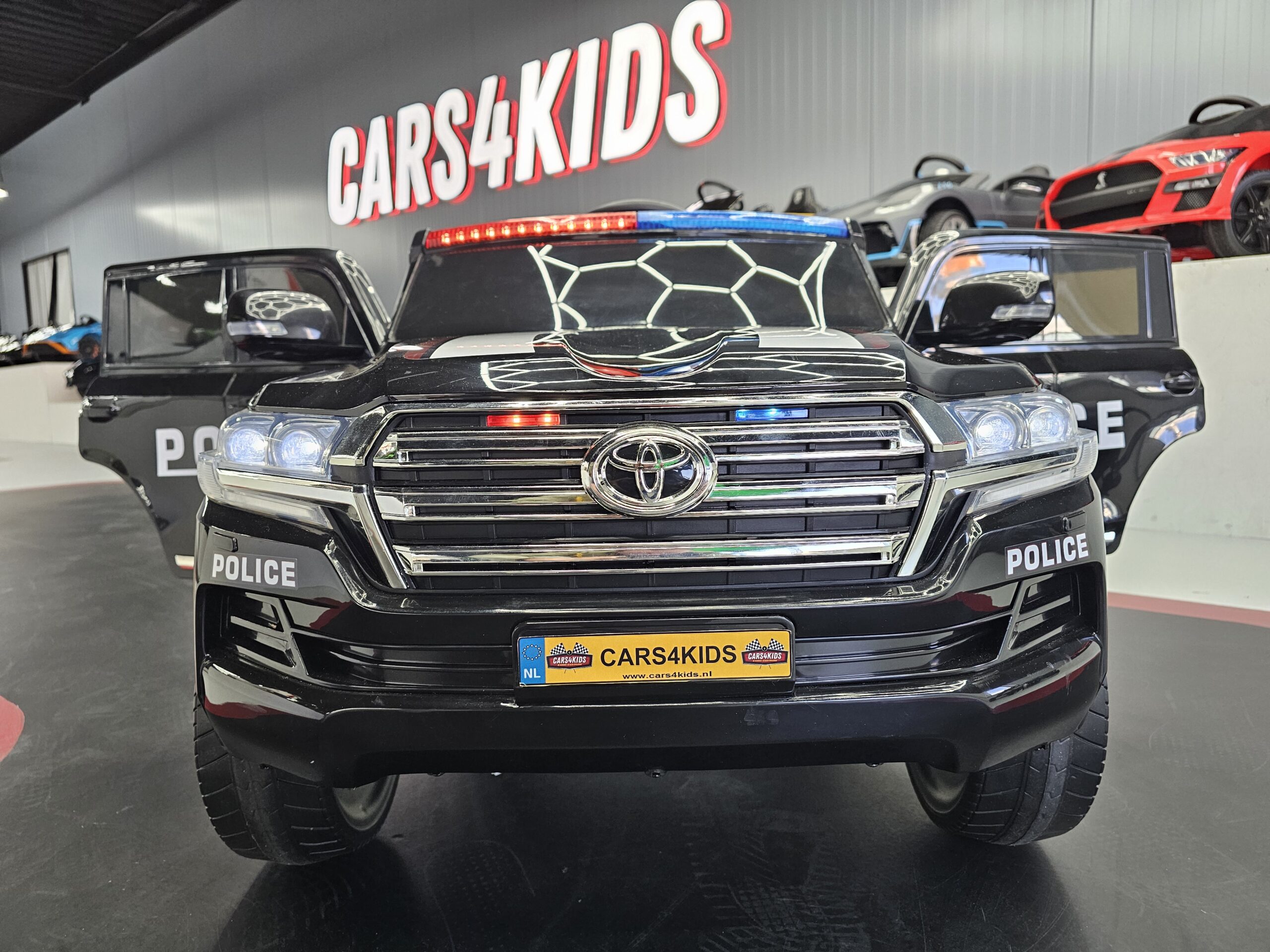 Kinderauto Toyota Land Cruiser politie 24 volt - Cars4Kids