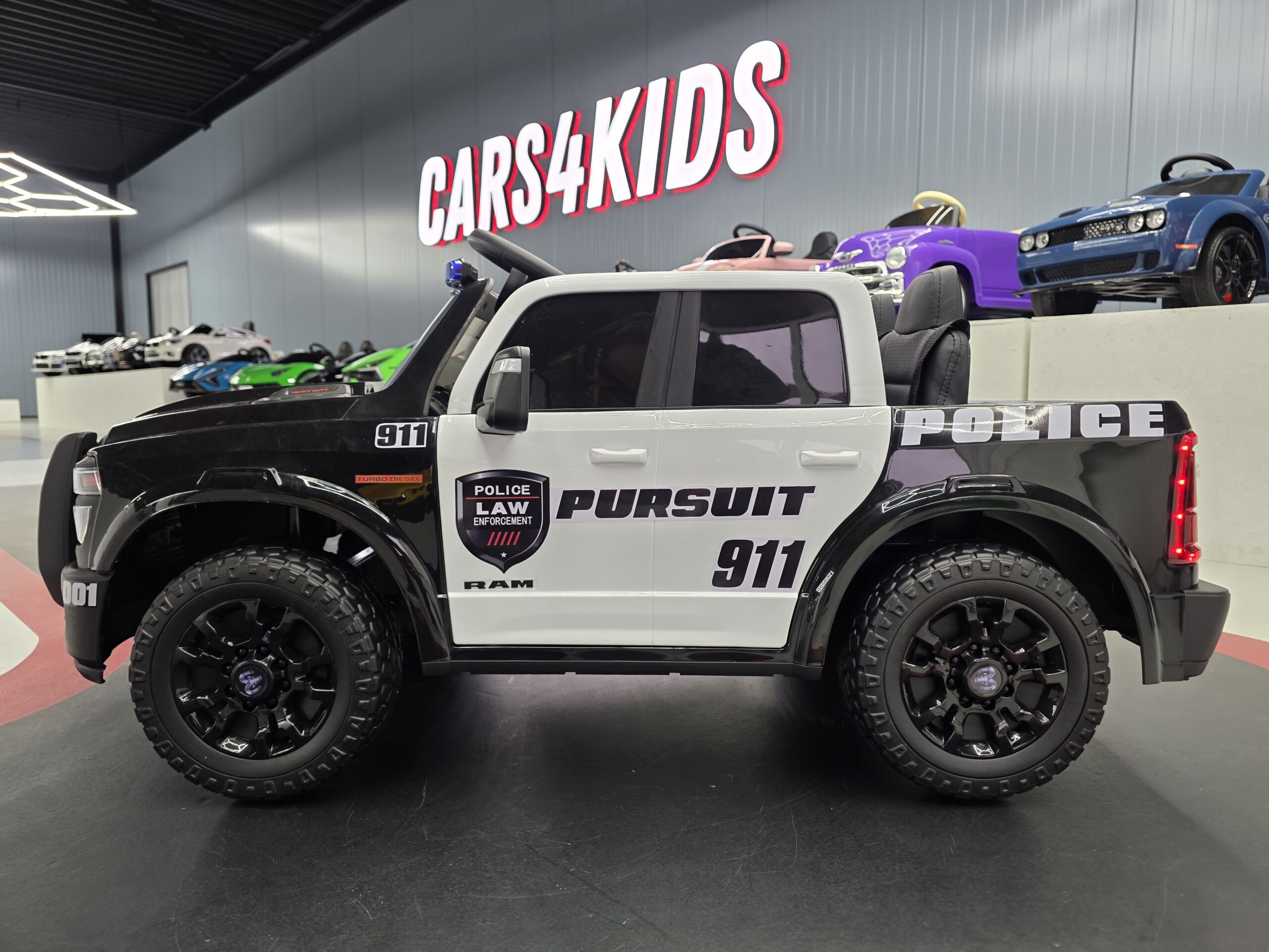 Kinderauto Dodge RAM politie 12 volt - Cars4Kids