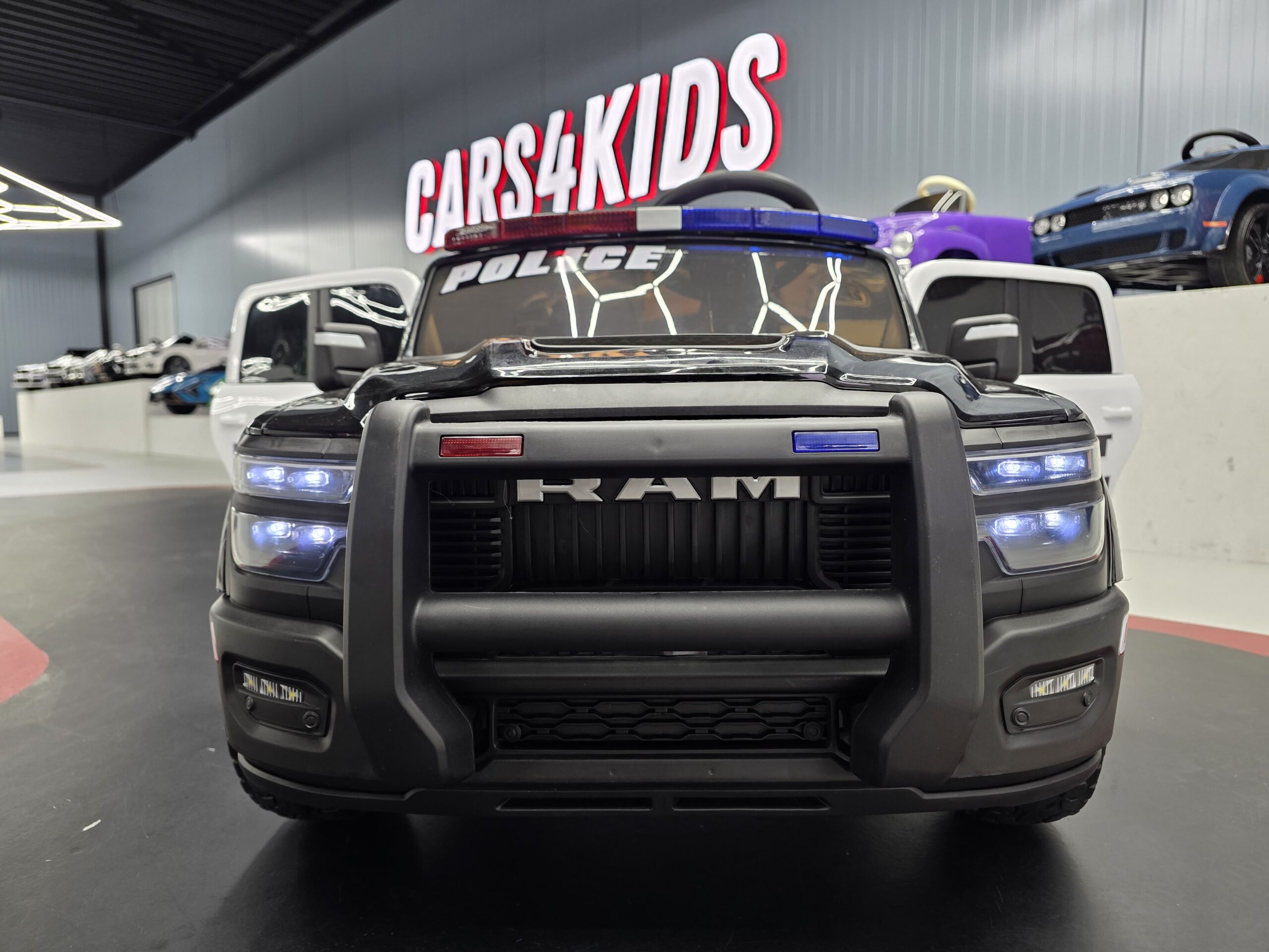 Kinderauto Dodge RAM politie 12 volt - Cars4Kids