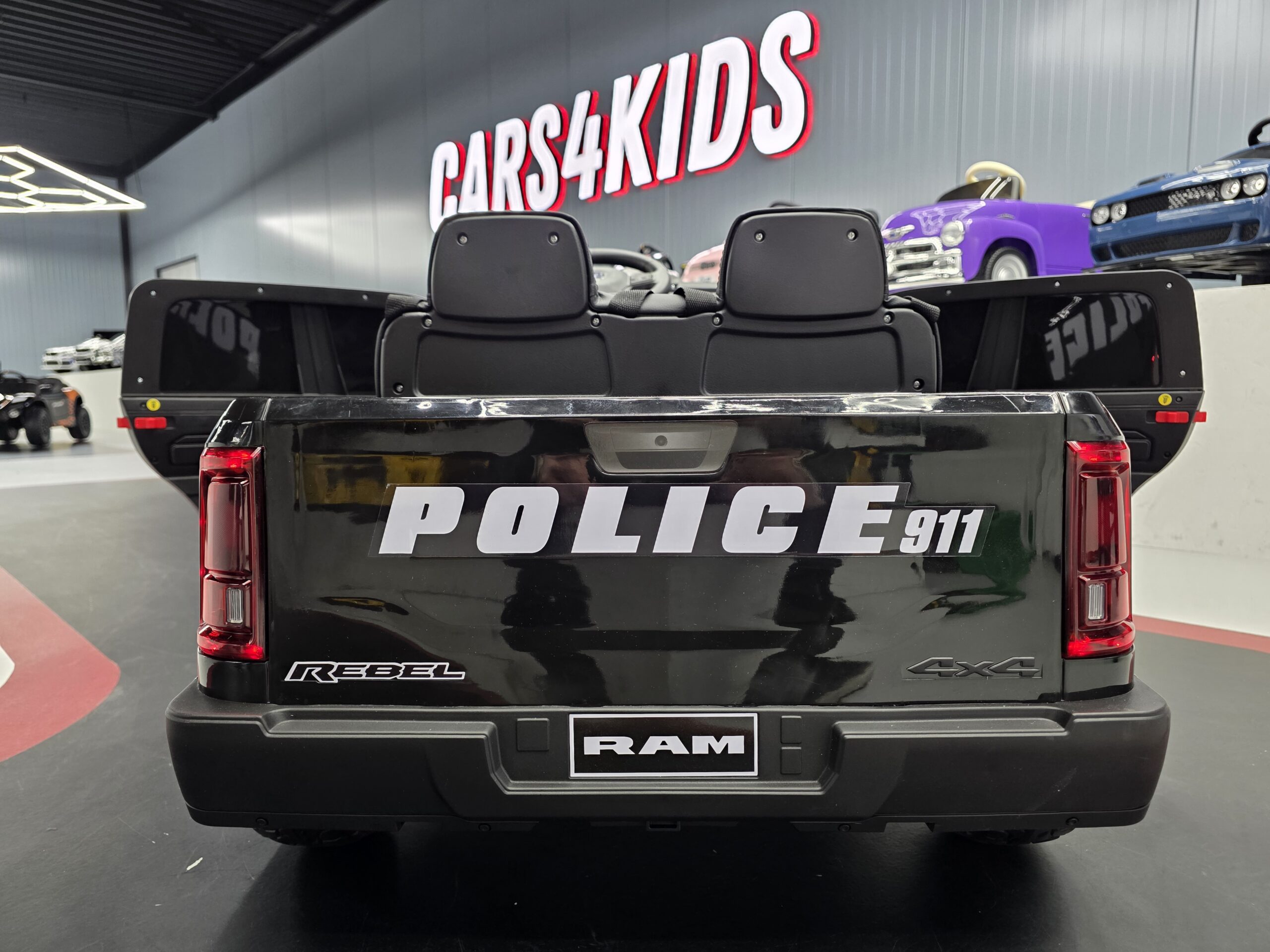 Kinderauto Dodge RAM politie 12 volt - Cars4Kids